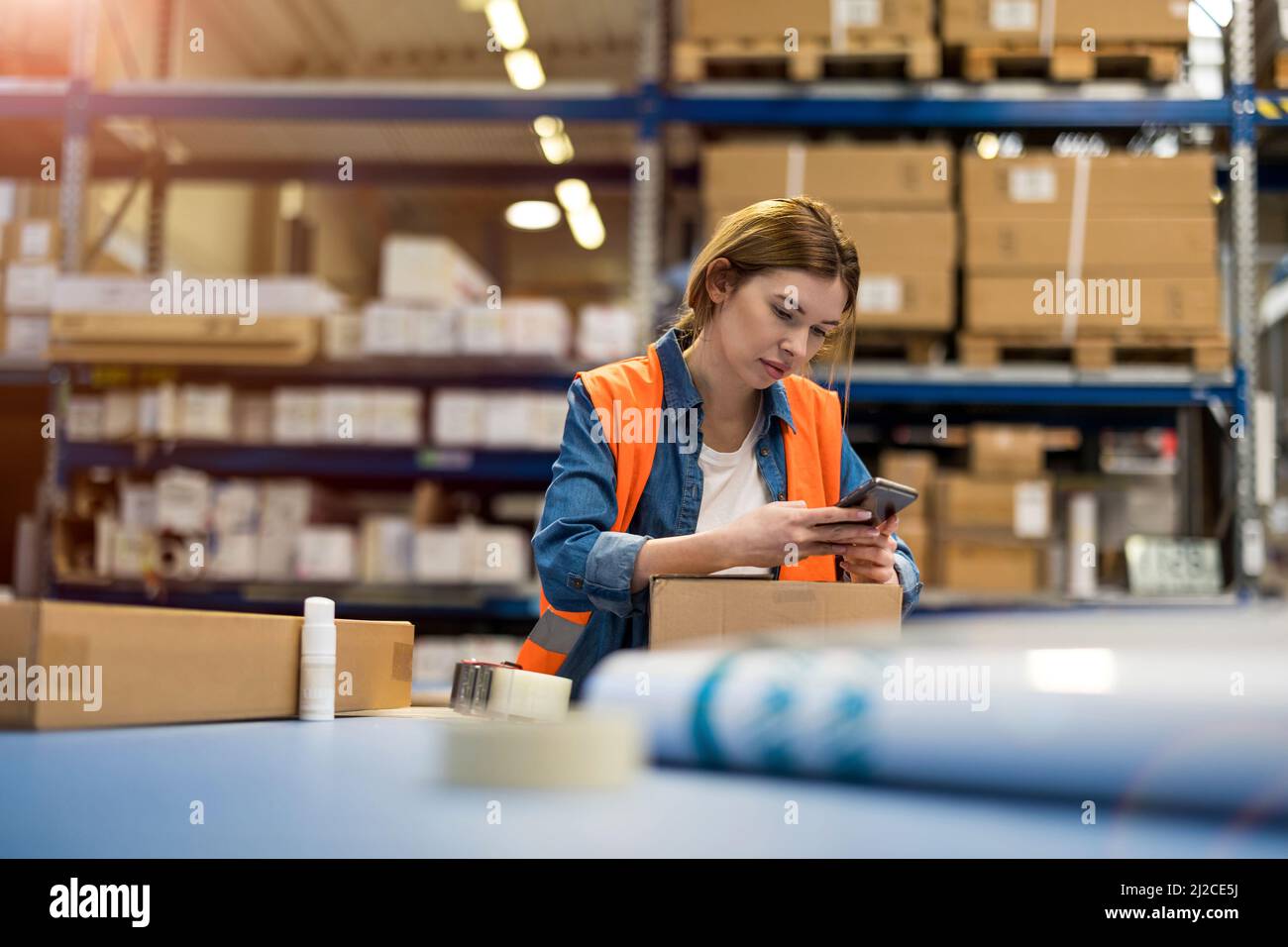 Young woman using smartphone tracking hi-res stock photography and ...