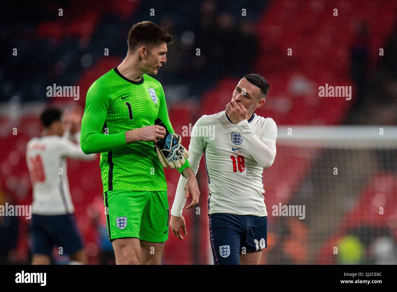 LONDON, ENGLAND - MARCH 29: Nick Pope, Phil Foden of England during the ...