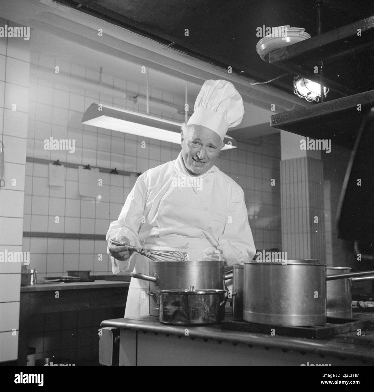 1950s chef cooking food in a large kitchen ca: June 26, 1954 Stock ...
