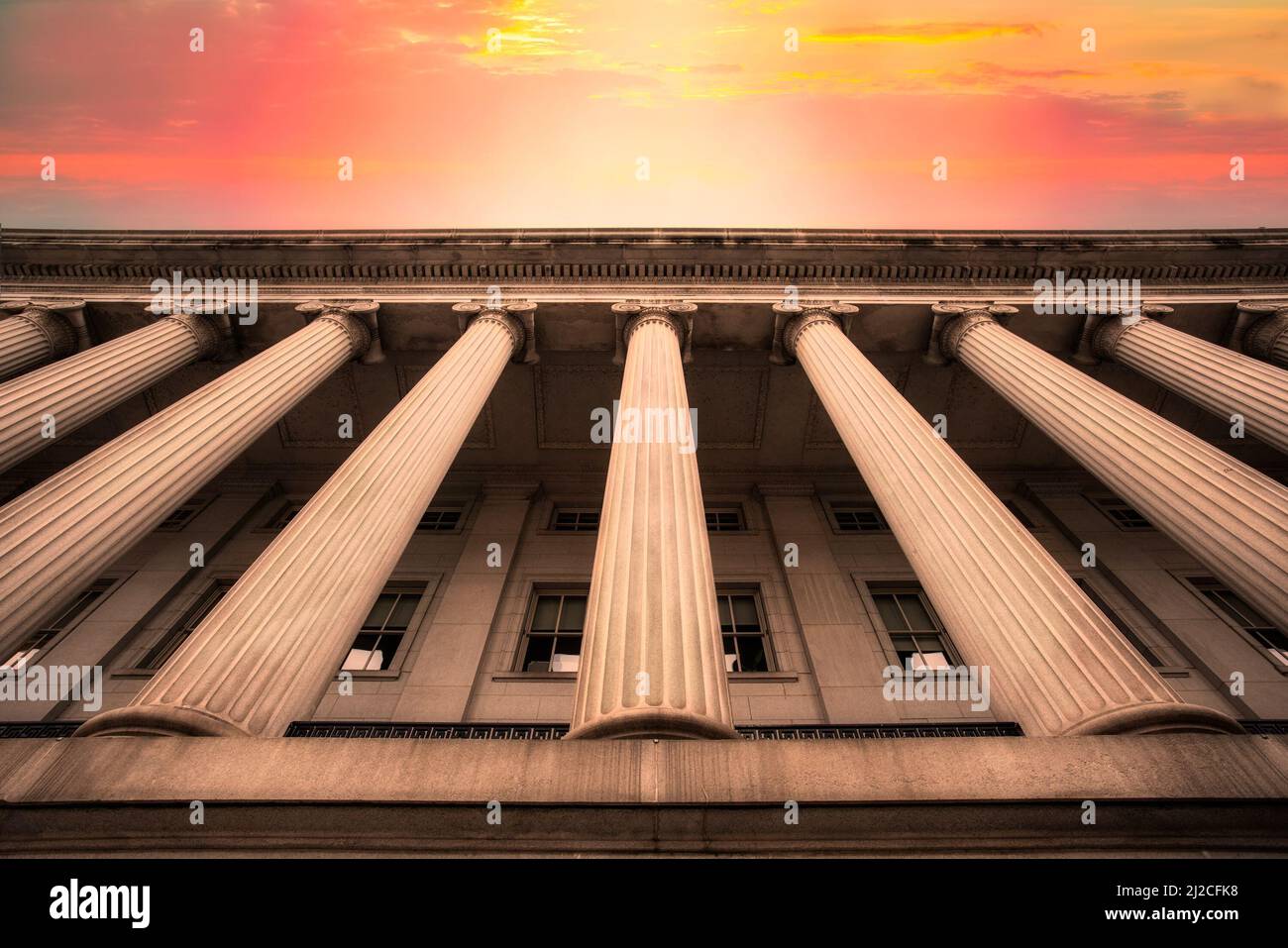 Classical columns on government building with colorful sky Stock Photo ...