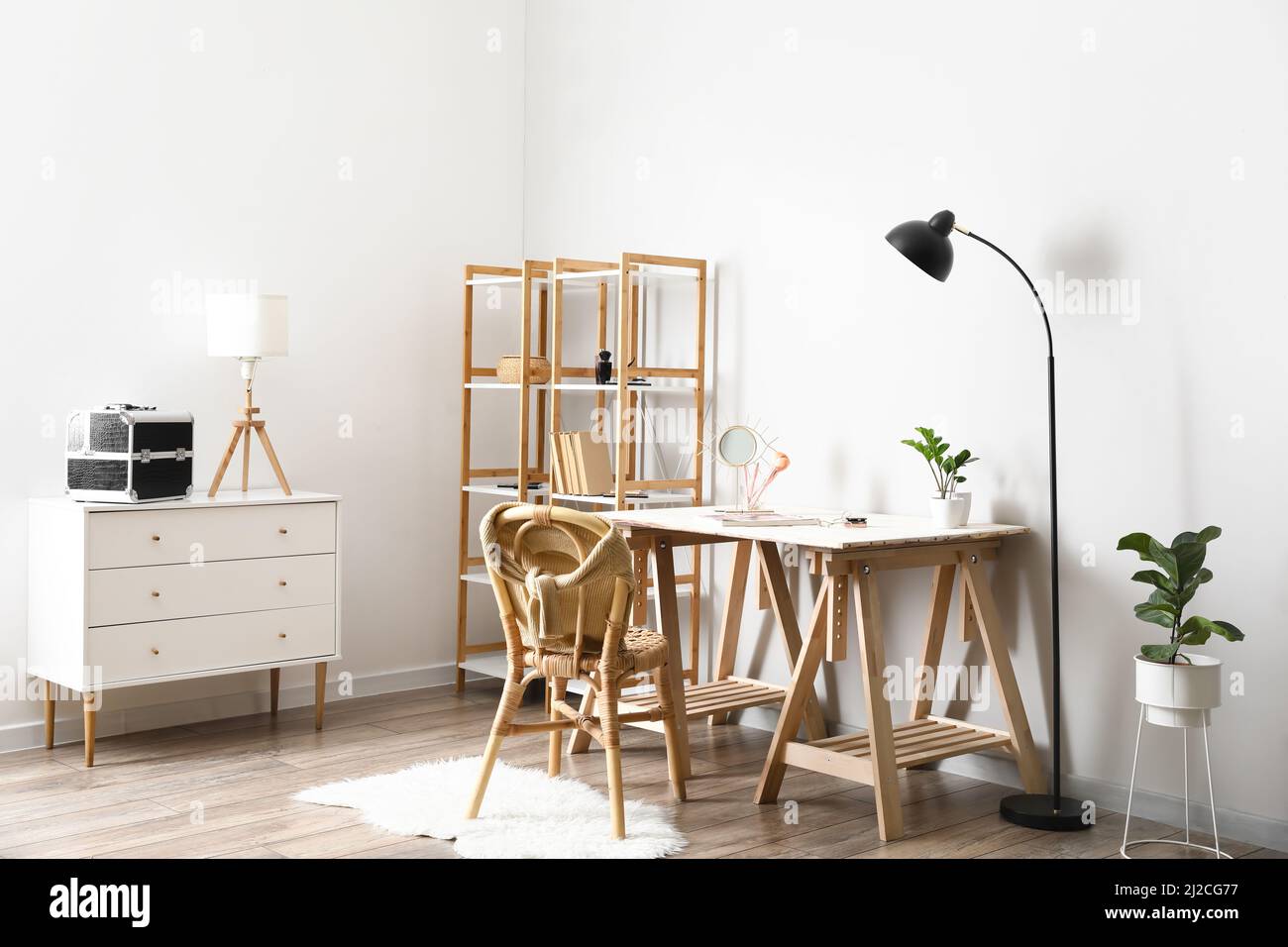 Interior of light room with shelving unit and modern workplace Stock ...