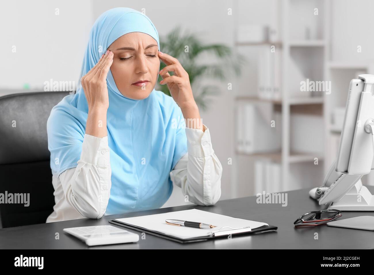 Stressed asian businesswoman working documents hi-res stock photography ...