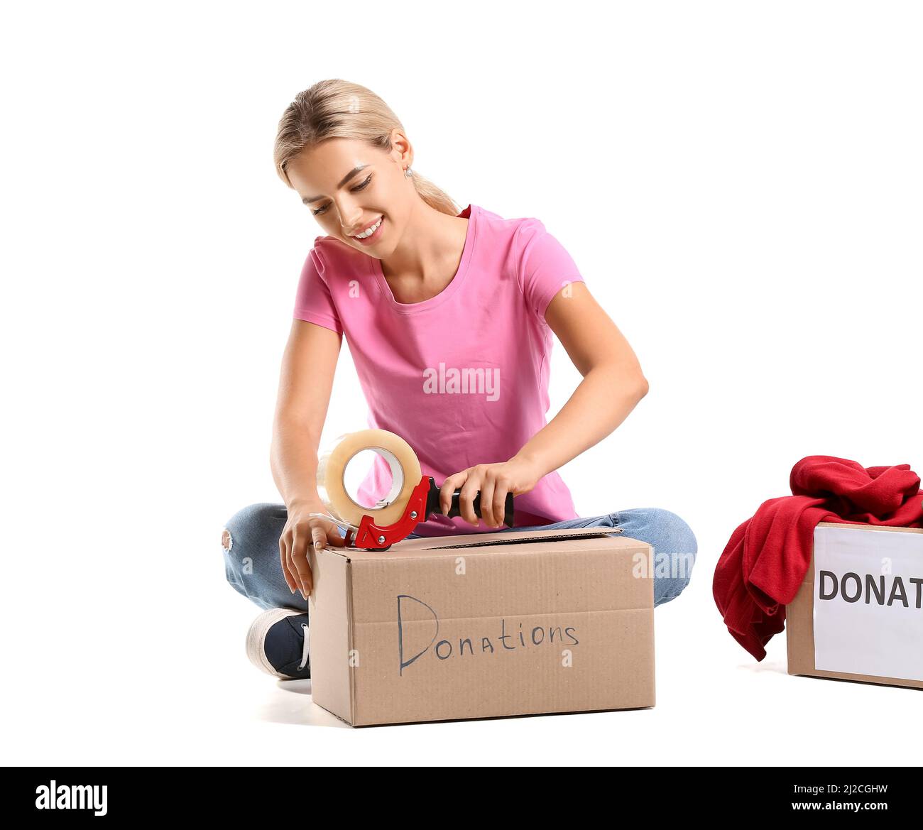 Beautiful woman packing box with donations on white background Stock ...