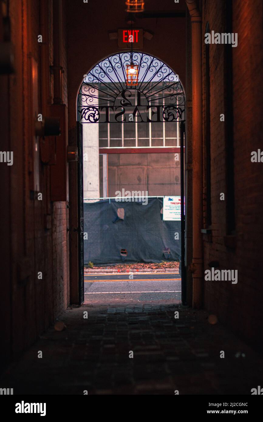 A vertical shot of an arched alleyway in Gainesville, Florida Stock ...