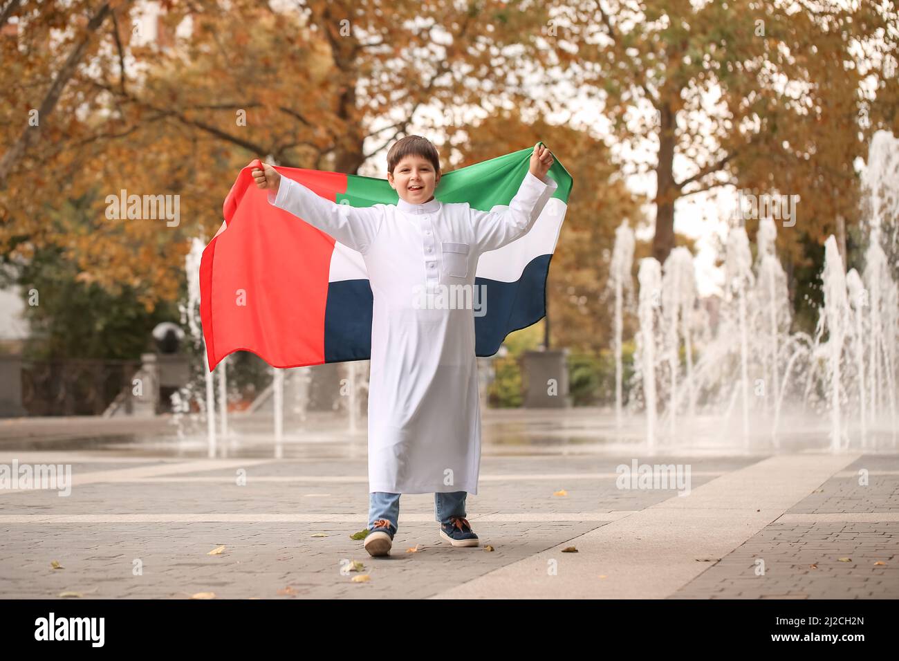 Cute little boy with national flag of UAE outdoors Stock Photo - Alamy