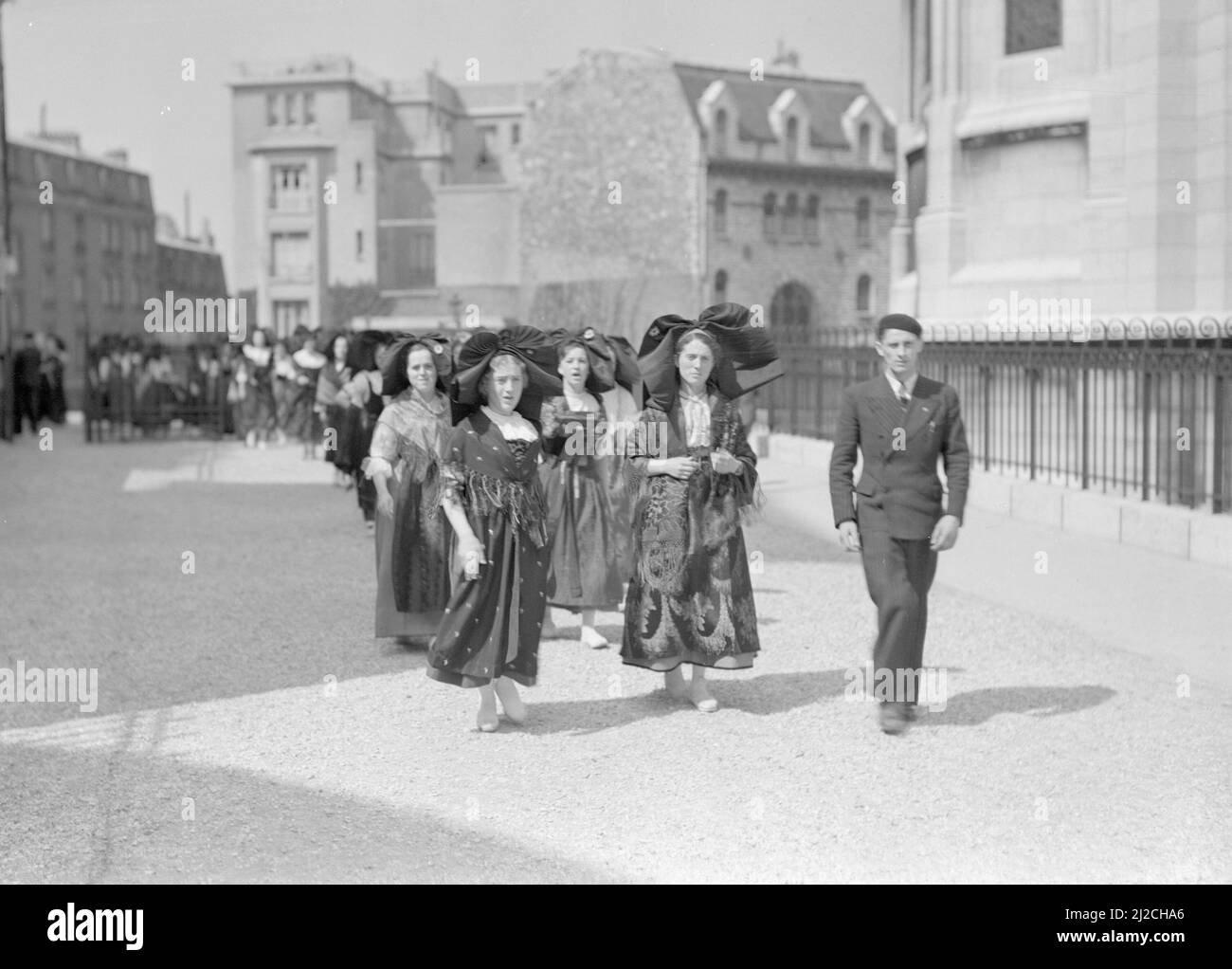 Man with a group of ladies in traditional costume ca: 1937 Stock Photo ...
