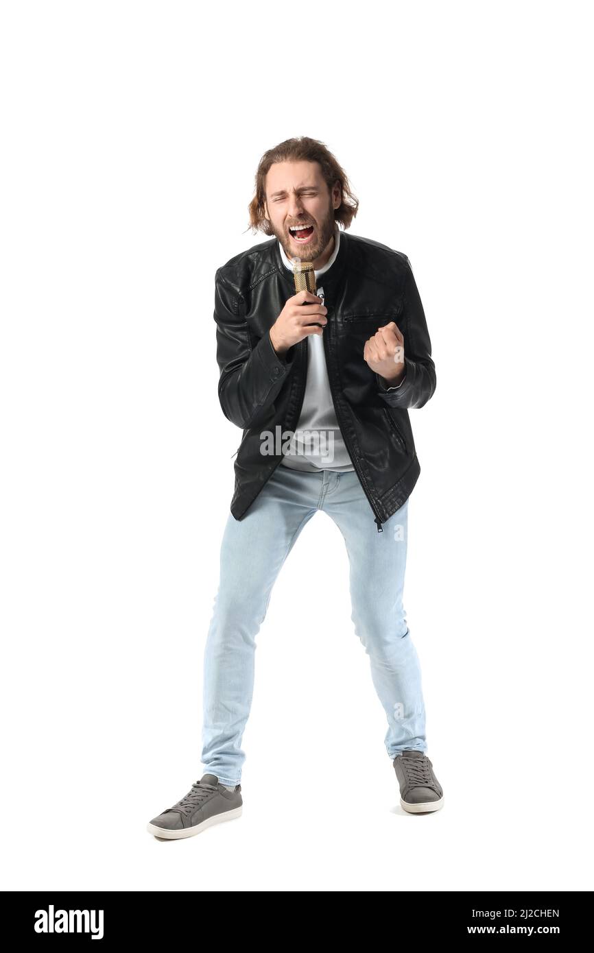 Handsome young man singing in microphone isolated on white Stock Photo ...