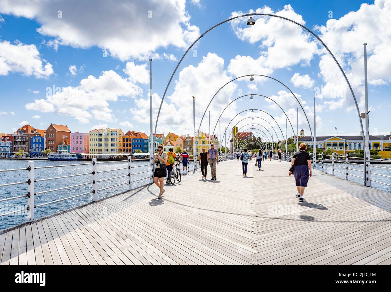 Queen-Emma-Bridge with famous colorful waterfront buildings in dutch ...