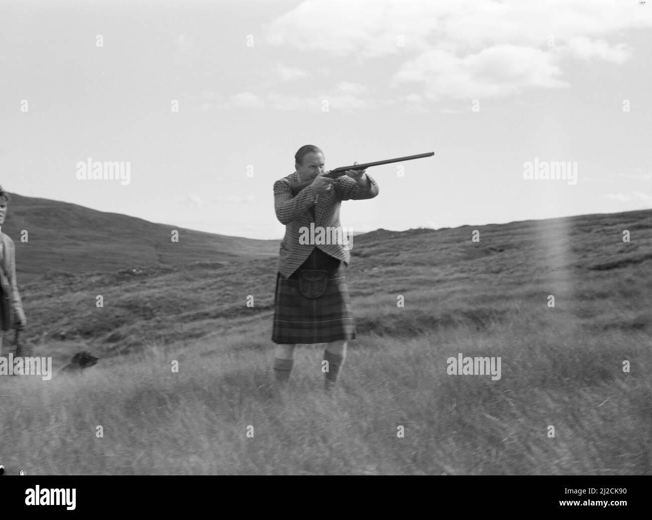 Hunter on Skye with a bird in his sights ca. 1930s-1950s Stock Photo ...