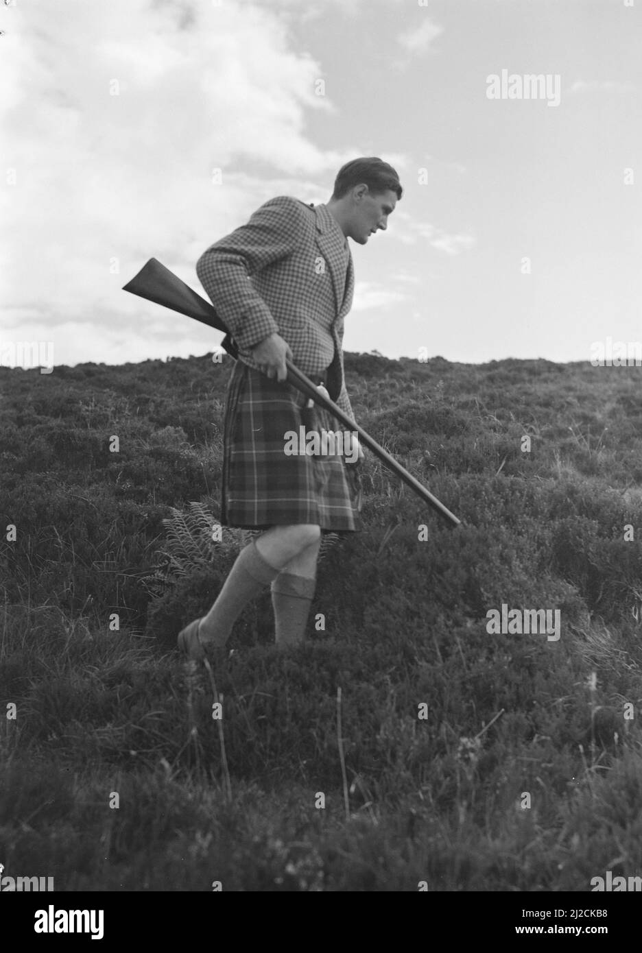 Hunter with a shotgun on the Isle of Skye ca. 1930s-1950s Stock Photo ...