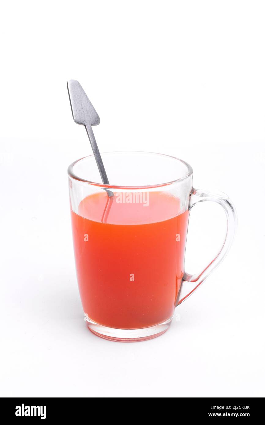 red hot drink in a glass mug on a white background Stock Photo - Alamy