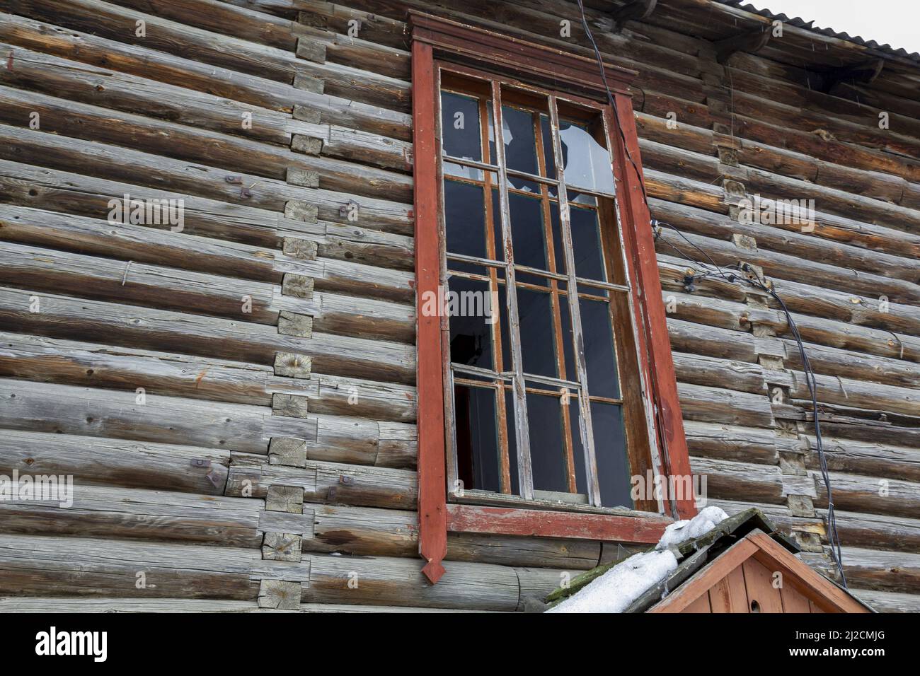 Facade window of a house with broken glass. Destroyed by an explosion ...