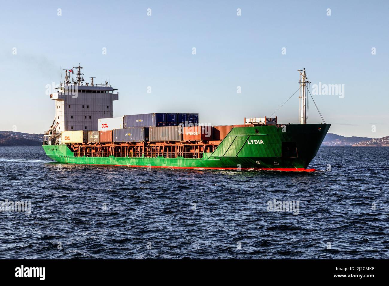 General cargo and container feeder vessel Lydia at Byfjorden, arriving ...