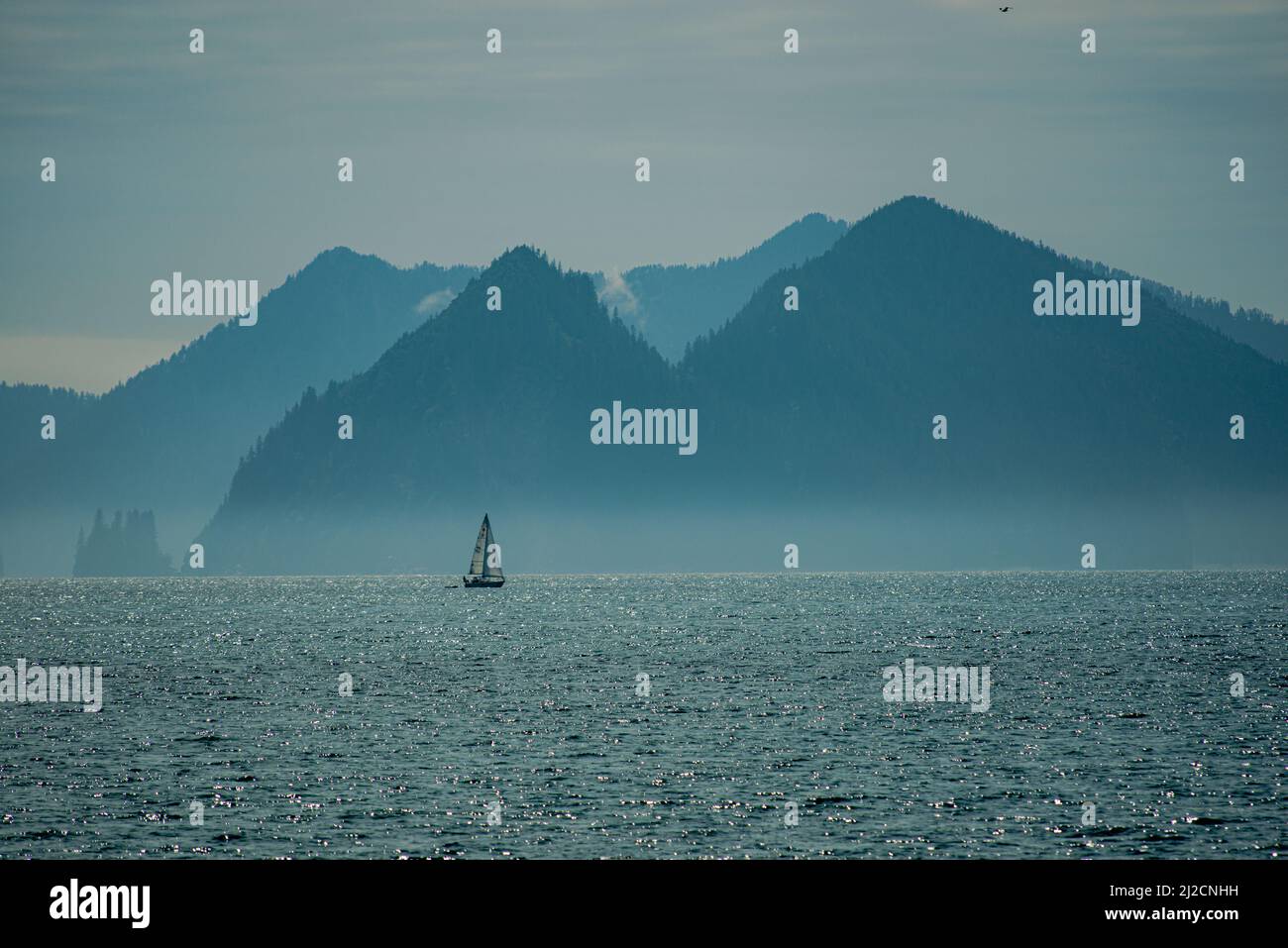 Sailboat in Alaska with mountains in background Stock Photo - Alamy