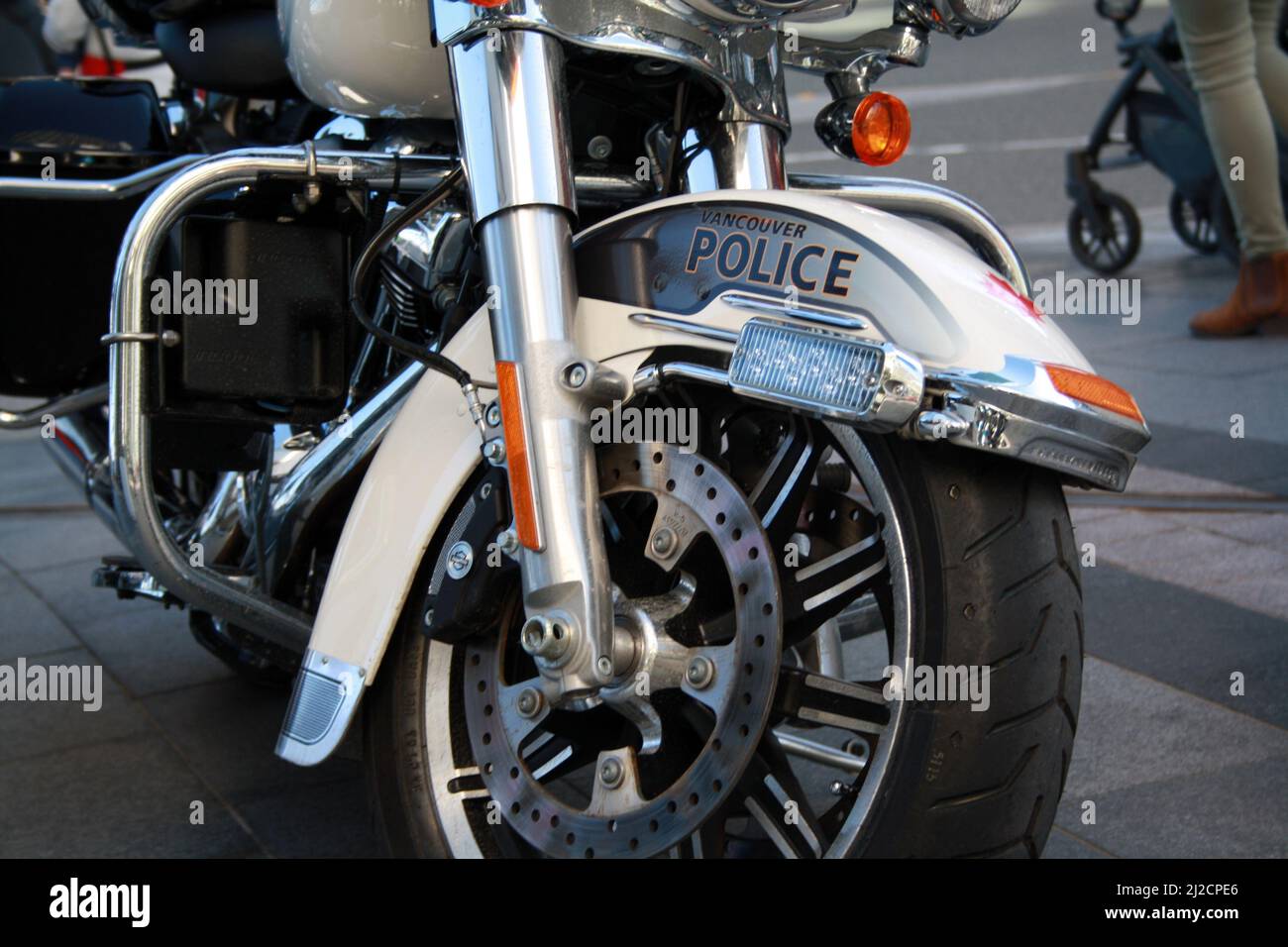 A closeup of the wheel of the Vancouver police motorcycle in downtown ...