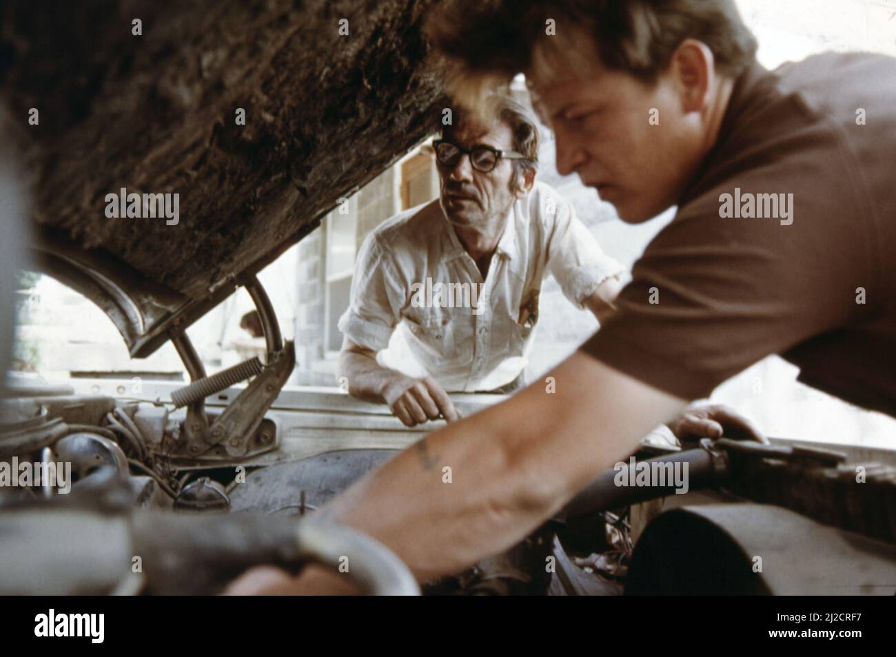 Two men try to find out the trouble with the family car were frustrated ...