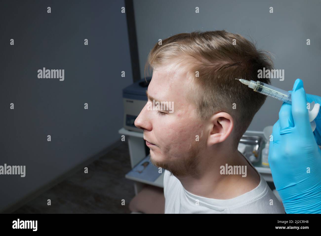 Injection plasma into head hair man cosmetologist doctor Stock Photo ...