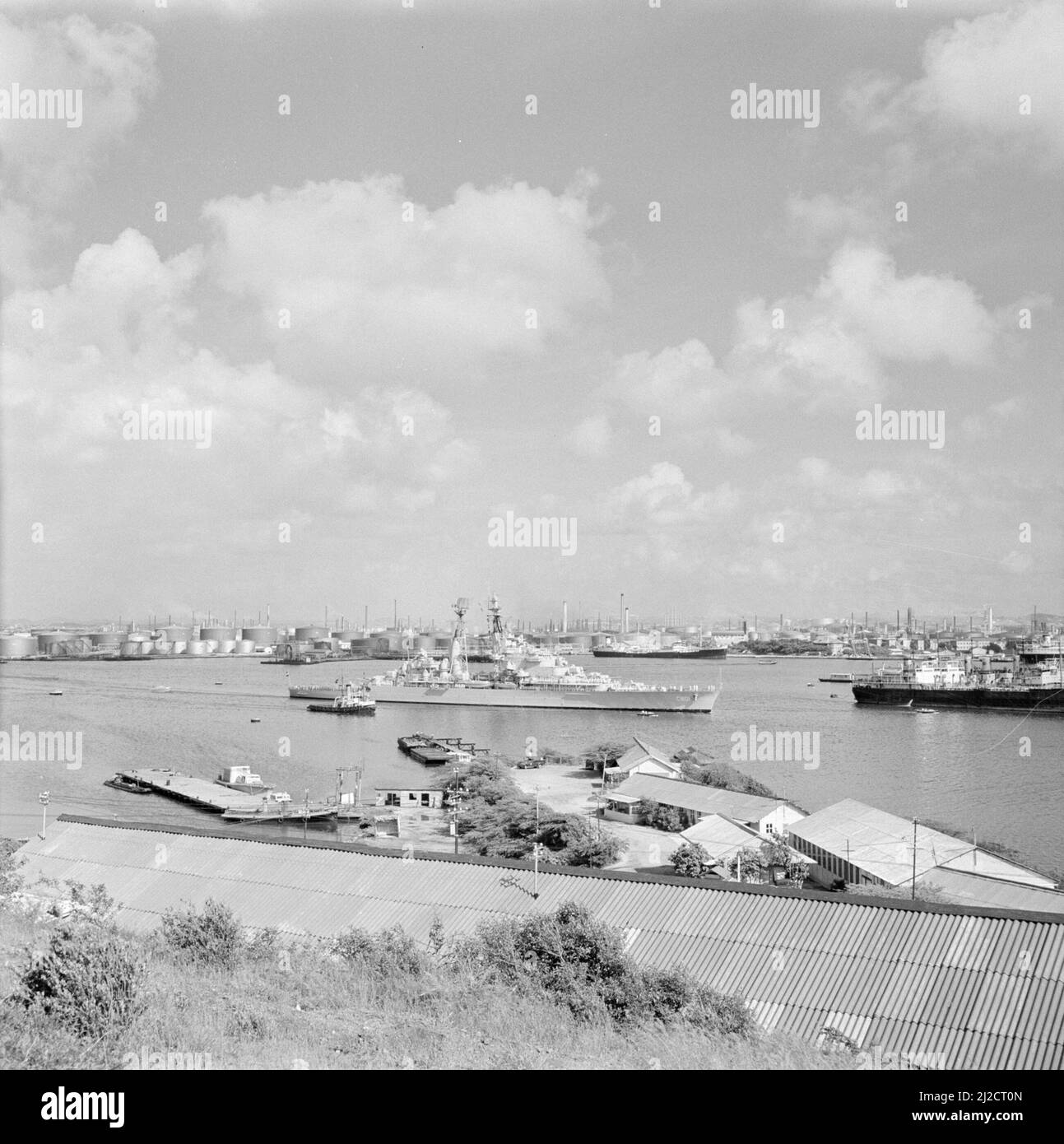 HM De Ruyter in the Schottegat with the Isla refinery in the background ...