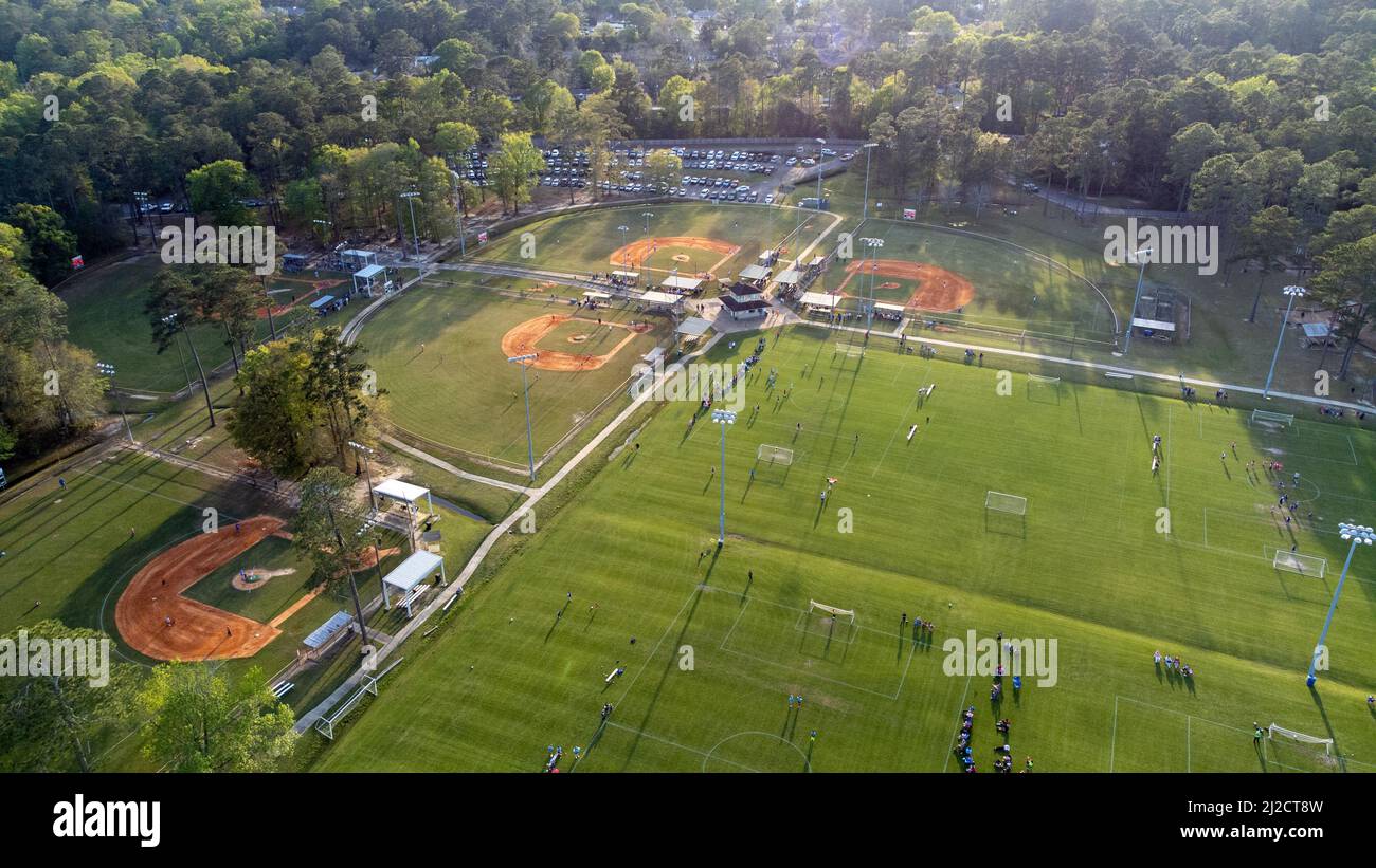 An aerial shot of soccer and baseball fields with trees around Stock ...