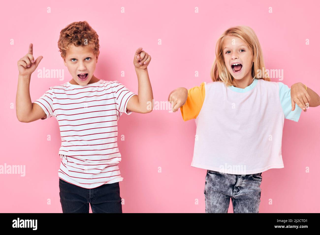 funny children gesturing with their hands playing childhood pink ...