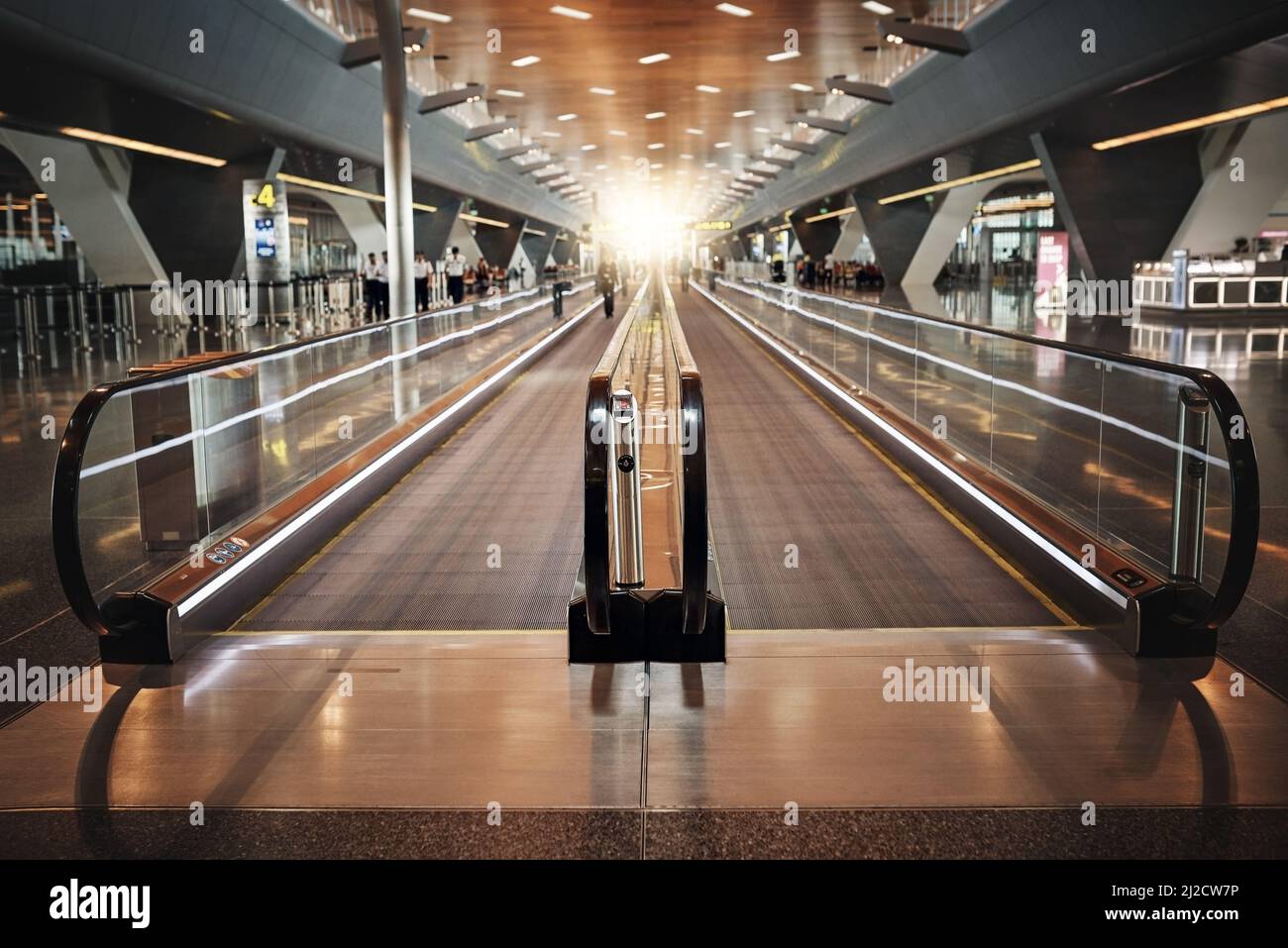 Your flight is this way. Cropped shot of a moving walkway in the ...