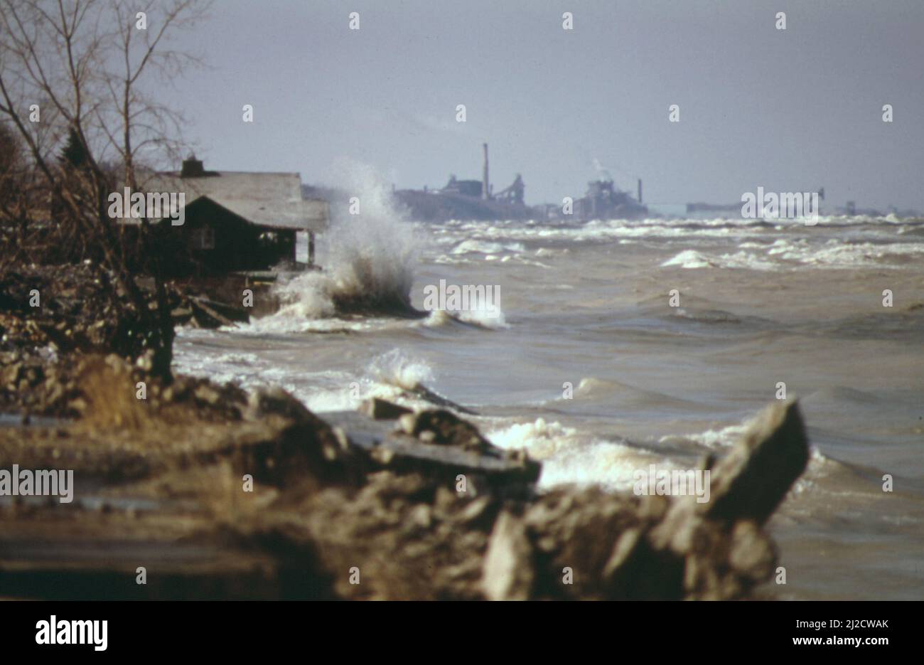 Storm tossed waves pound lake side home at Beverly Shores ca. 1973 ...