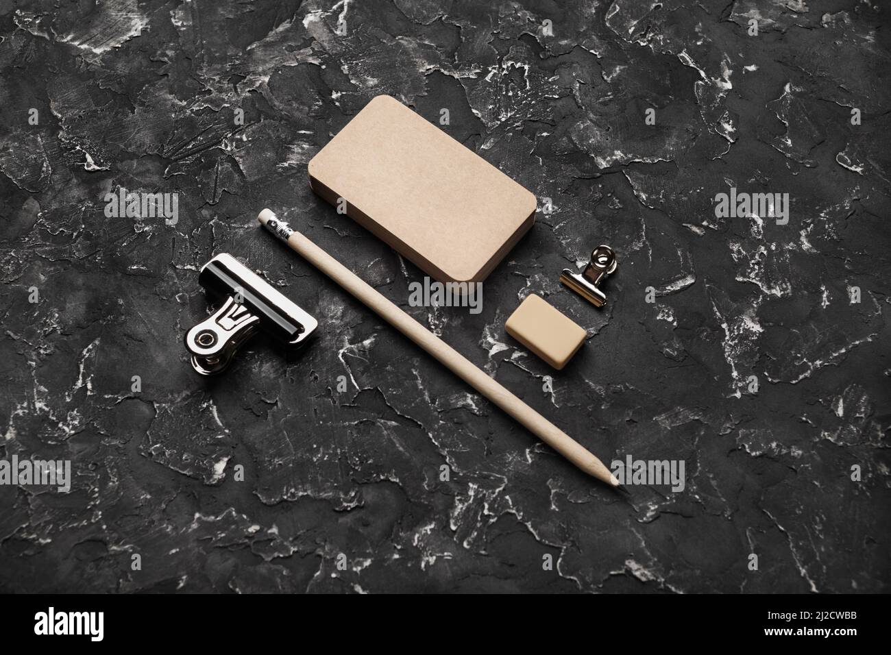 Photo of blank vintage business cards, pencil, eraser and clips on ...