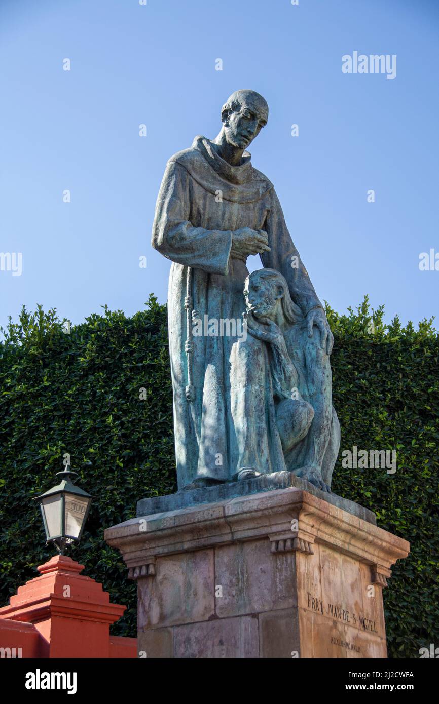Statue cement plaster priest father on a pedestal hi-res stock ...