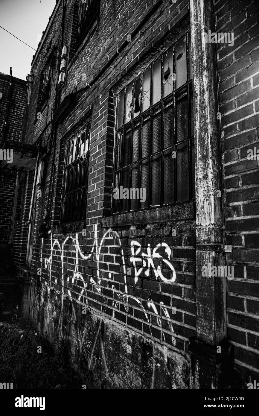 A vertical grayscale shot of an old residential building Stock Photo ...