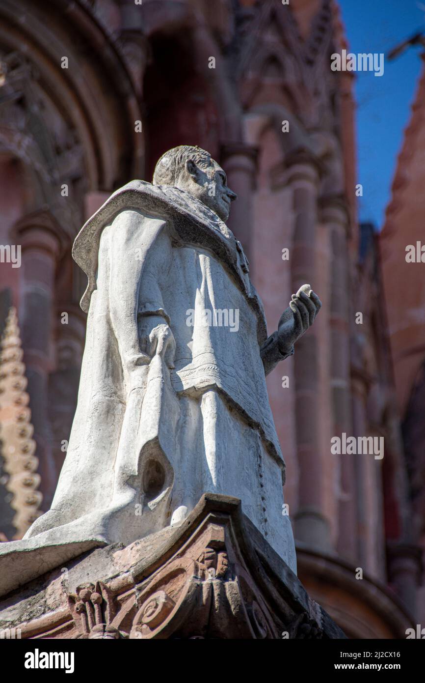 A religious statue in front of a church. San Miguel de Allende ...