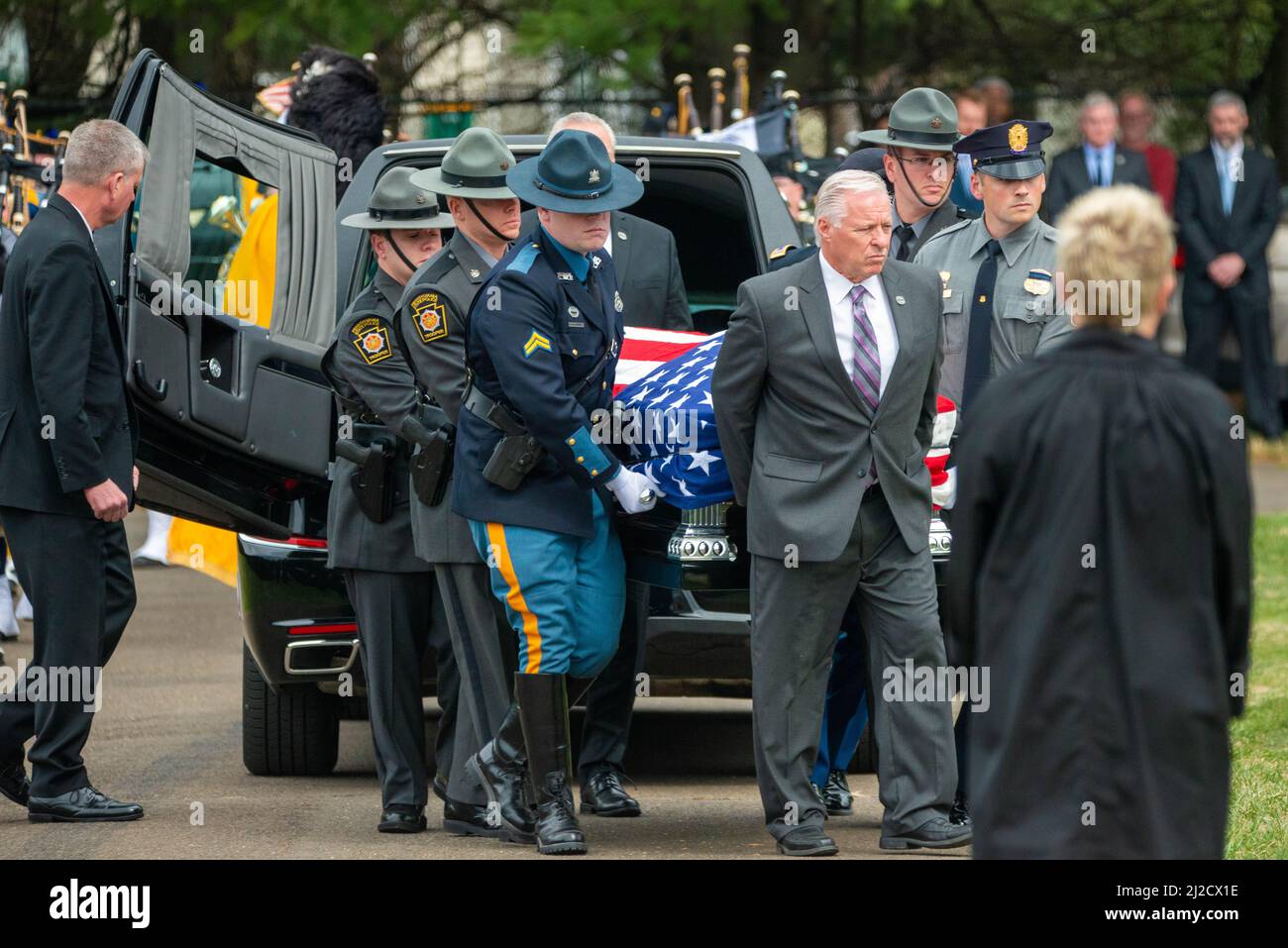 Langhorne, United States. 31st Mar, 2022. Troopers carry a casket with ...