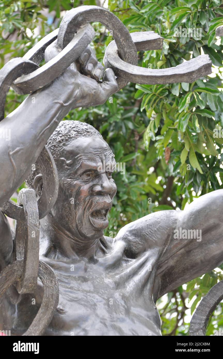A vertical shot of the Zambian Freedom statue in front of the ...