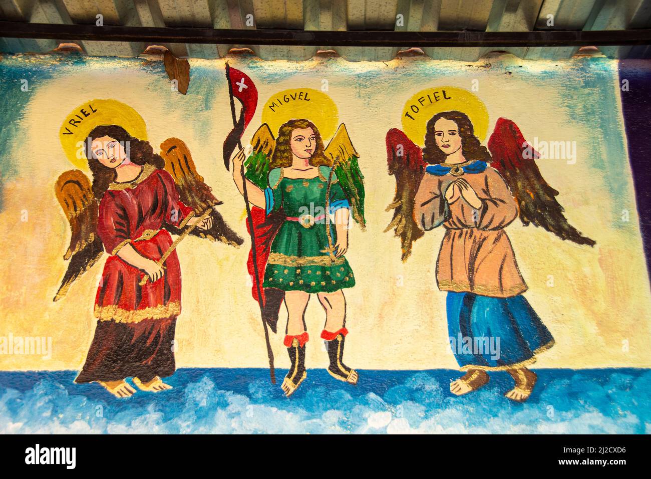 Three angel appearing religious figures painted on a panel. San Miguel ...