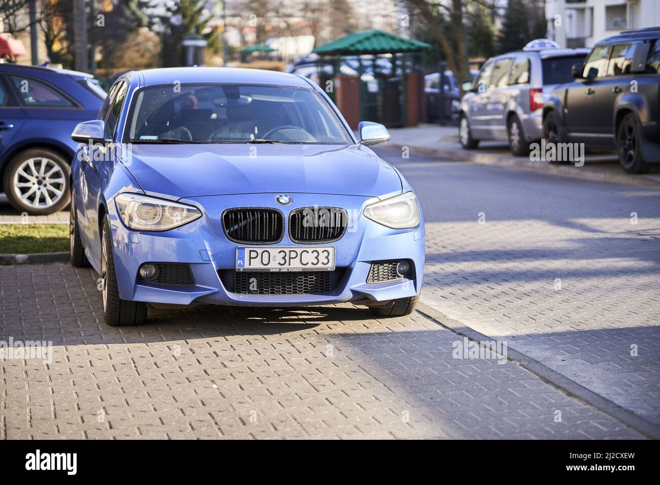 A parked blue modern BMW car in the Stare Zegrze district Stock Photo ...