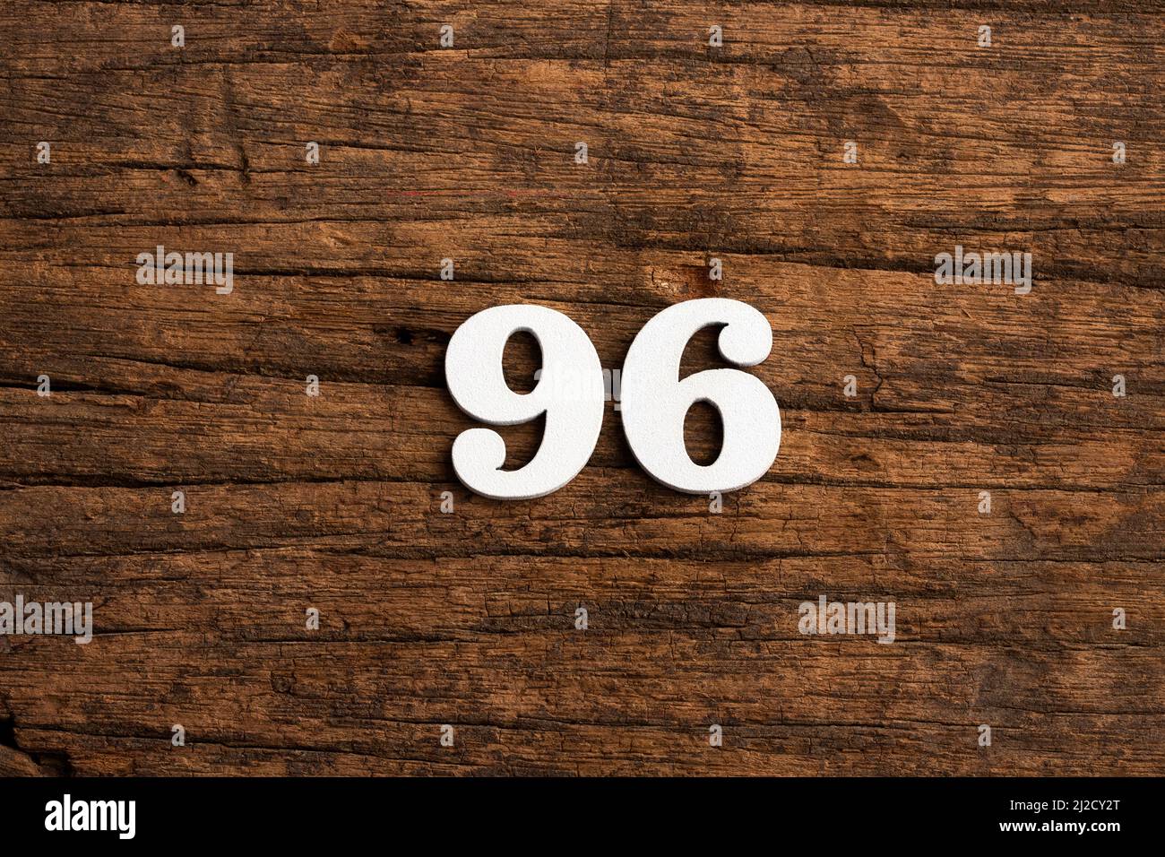 Number 96 in wood, isolated on rustic background Stock Photo - Alamy