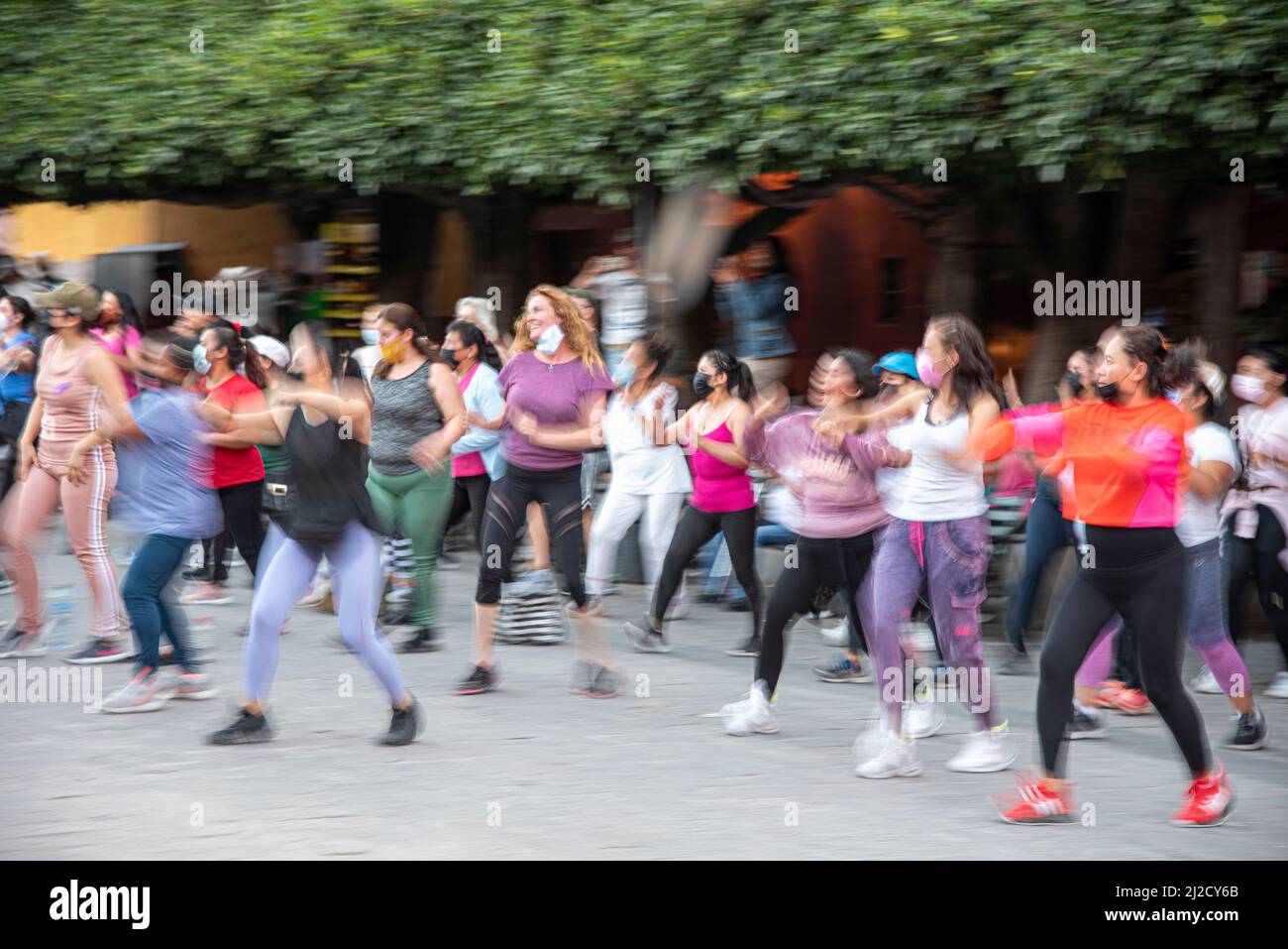A group of Mexican locals gets together to do some exercise at a side ...