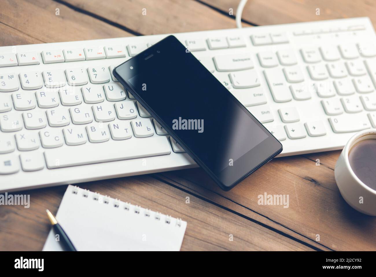 office desk table with smartphone and coffee cup Stock Photo - Alamy