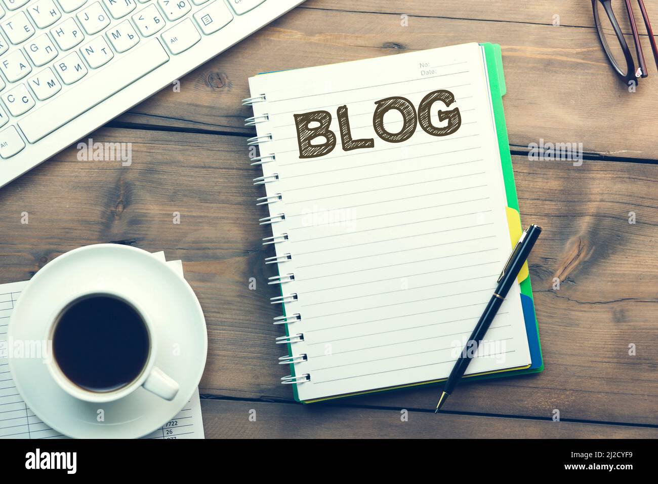 blog word on notepad and keyboard on desktop Stock Photo - Alamy