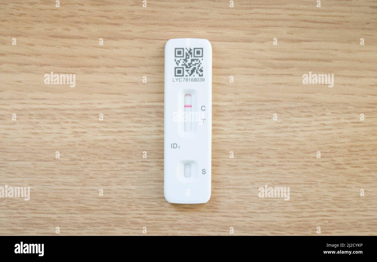 UNITED KINGDOM - March 26, 2022. Flat lay of Covid LFT test strip on a ...