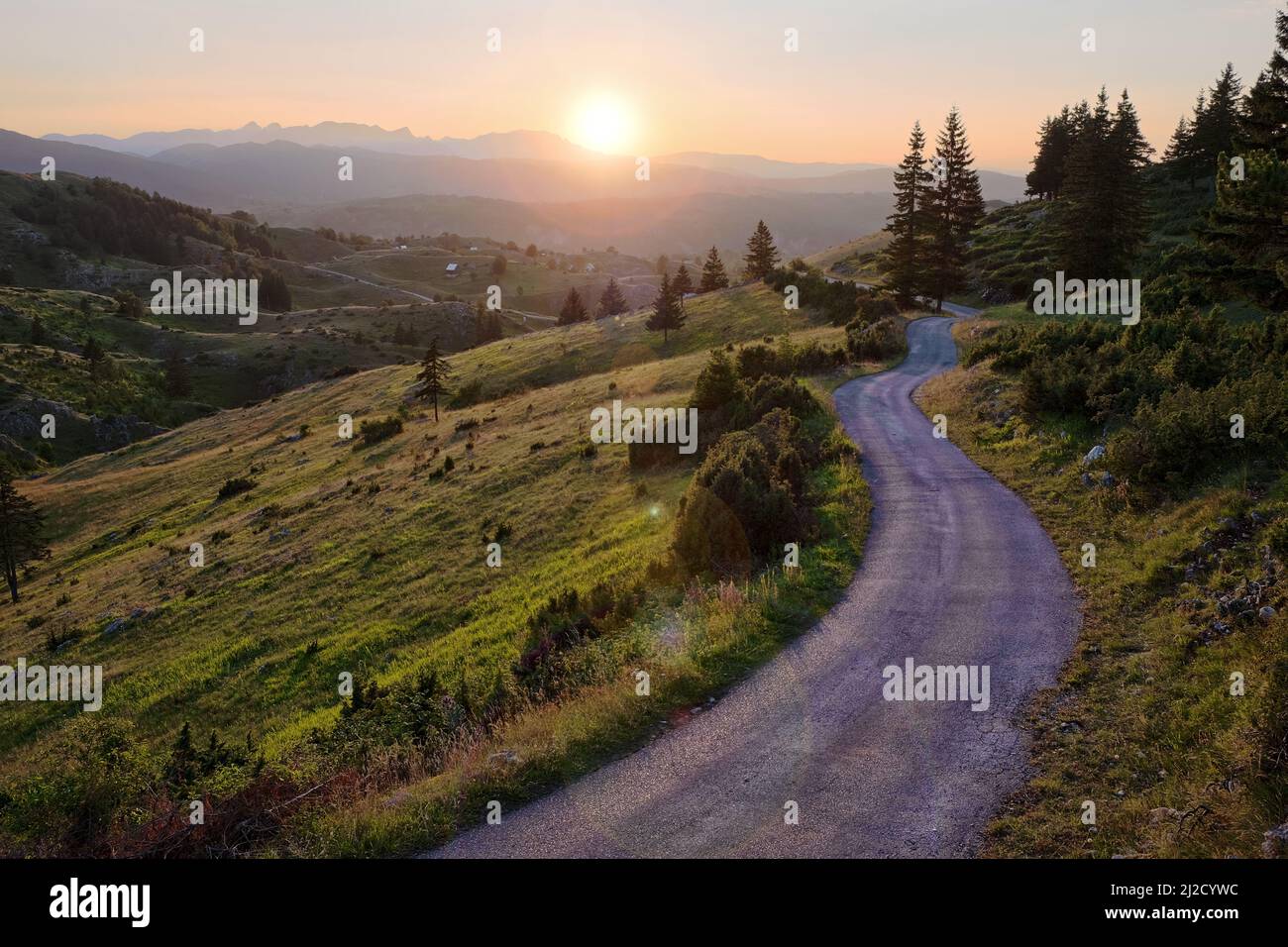 winding road to Mala Crna Gora at sunset in Durmitor National Park ...