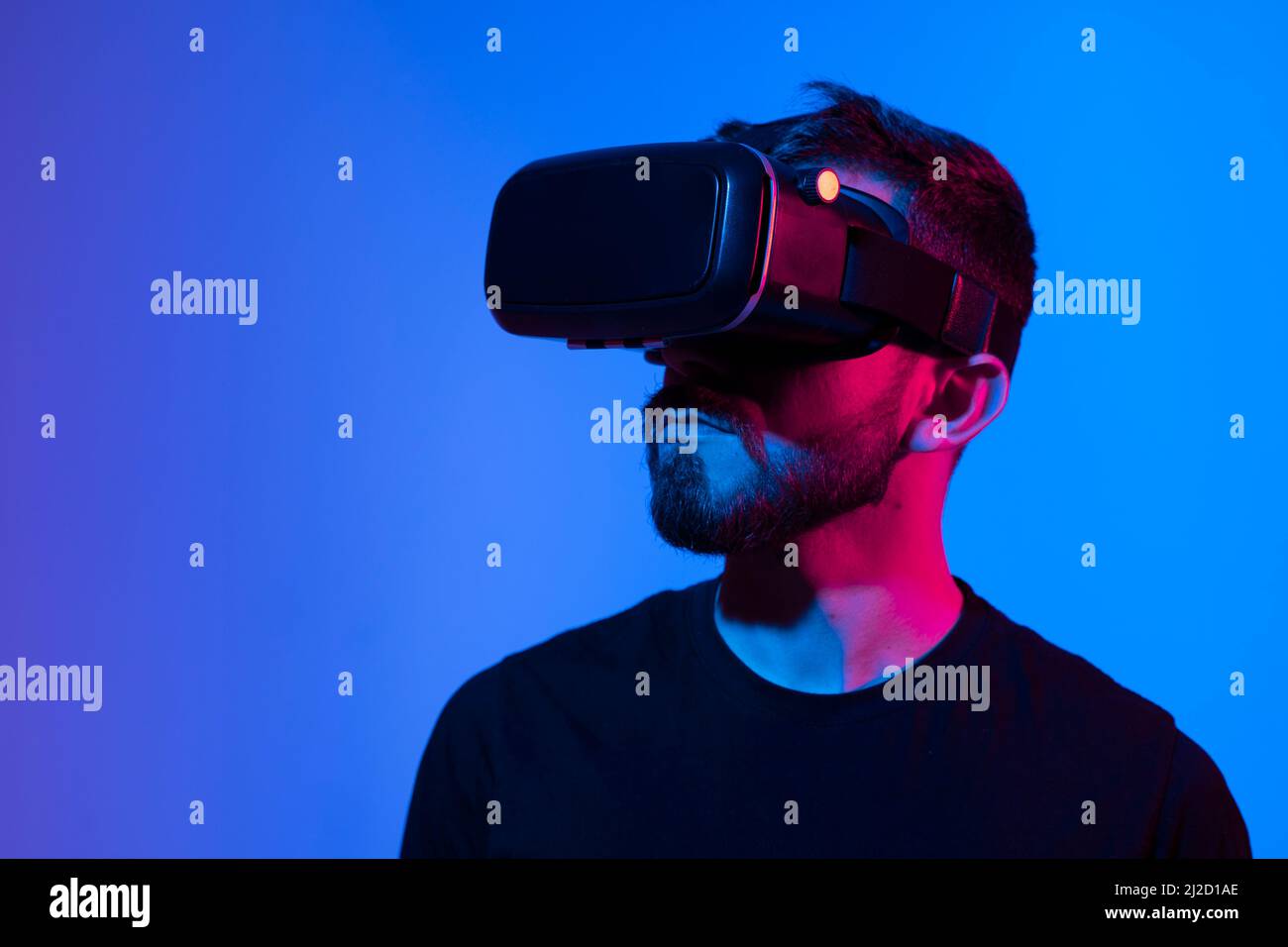 Future innovation technology concept. Portrait of young man wearing VR ...