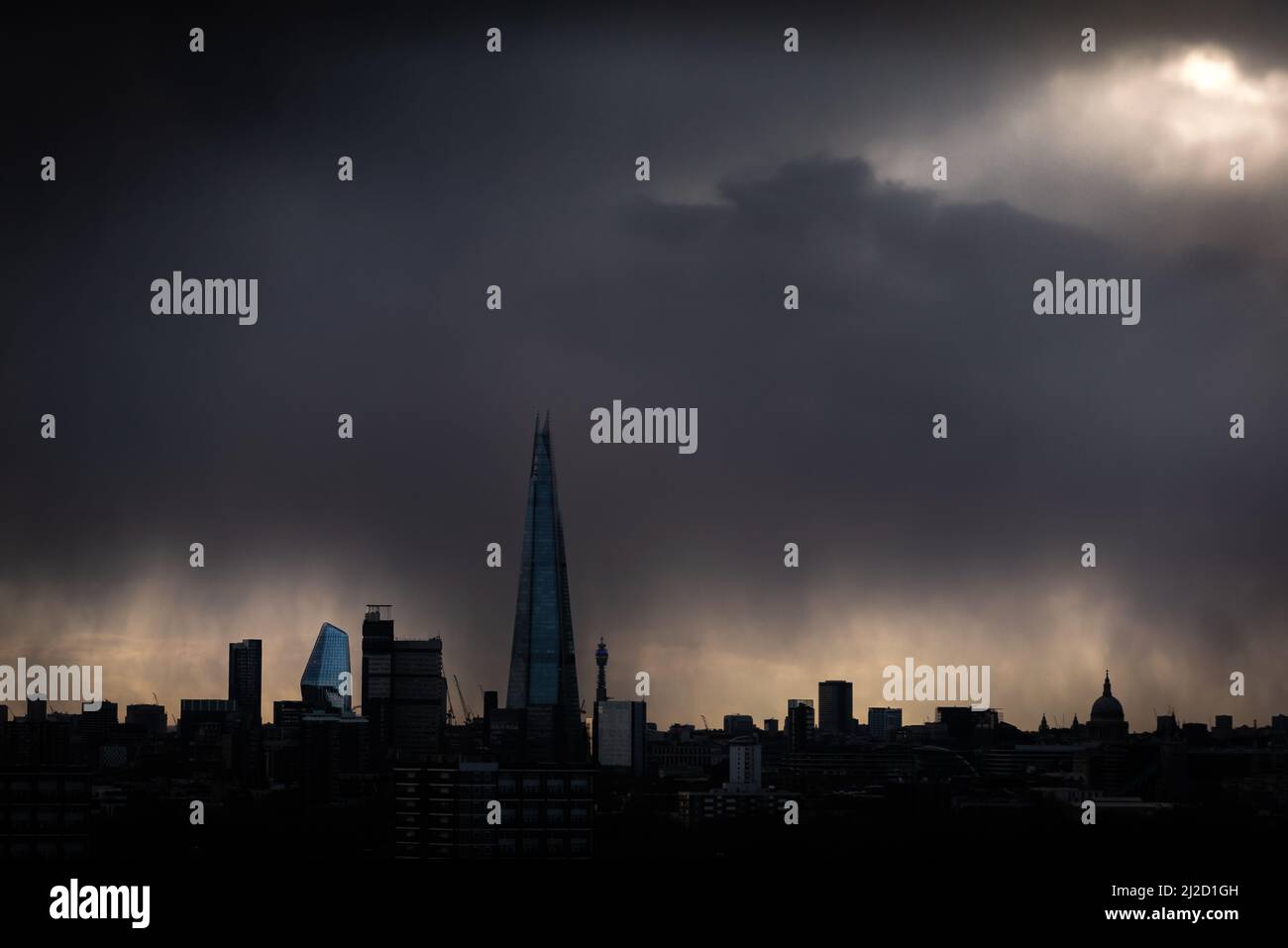 London, UK. 31st March, 2022. UK Weather: Rainstorm sunset over the ...