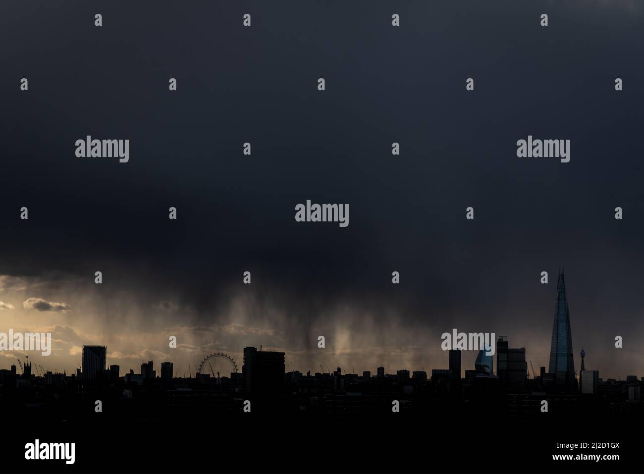 London, UK. 31st March, 2022. UK Weather: Rainstorm sunset over the city as cold weather ...