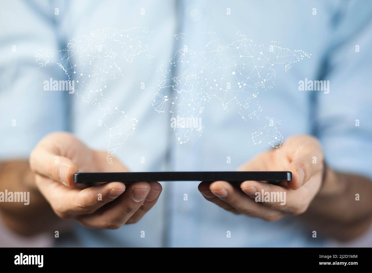 man hand tablet on world map Stock Photo - Alamy