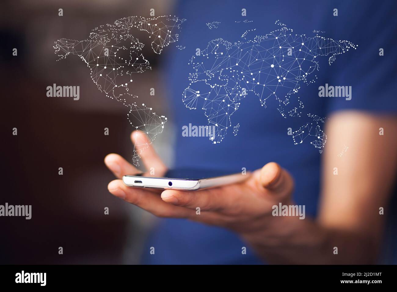 man hand phone on world map Stock Photo - Alamy