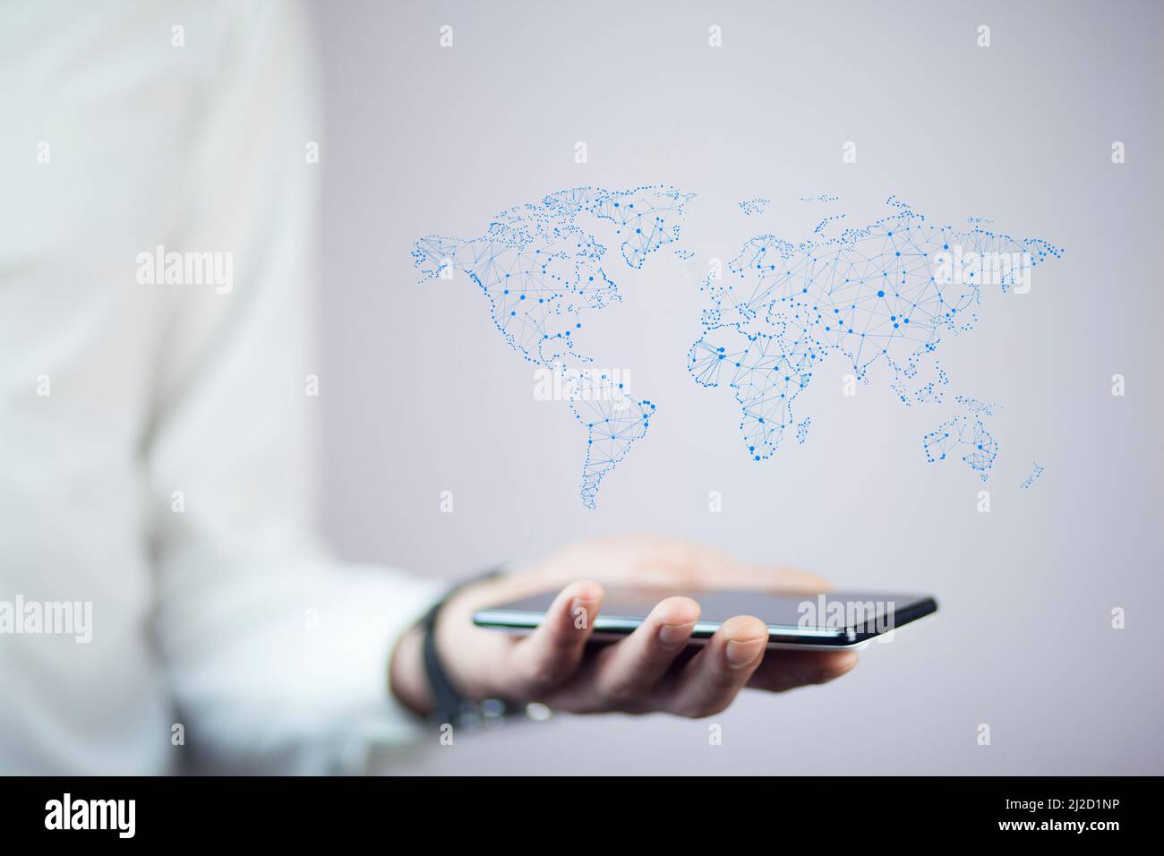 man hand phone on world map Stock Photo - Alamy