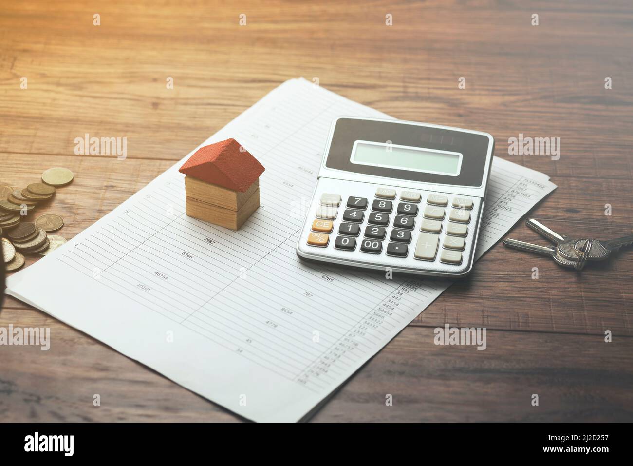 house,calculator and key on document Stock Photo - Alamy
