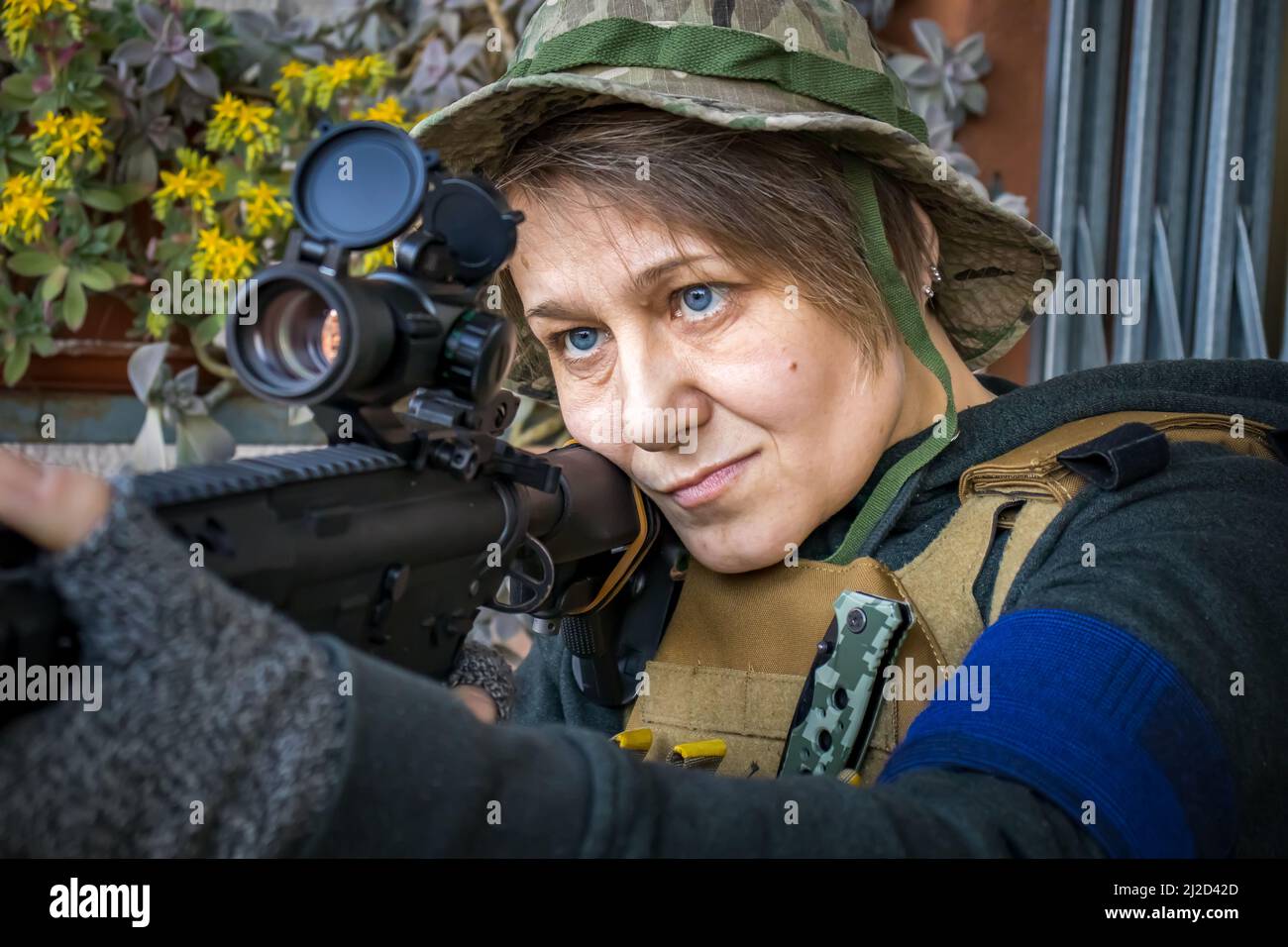 Real Ukrainian civilian woman holding a rifle to defend Ukraine ...