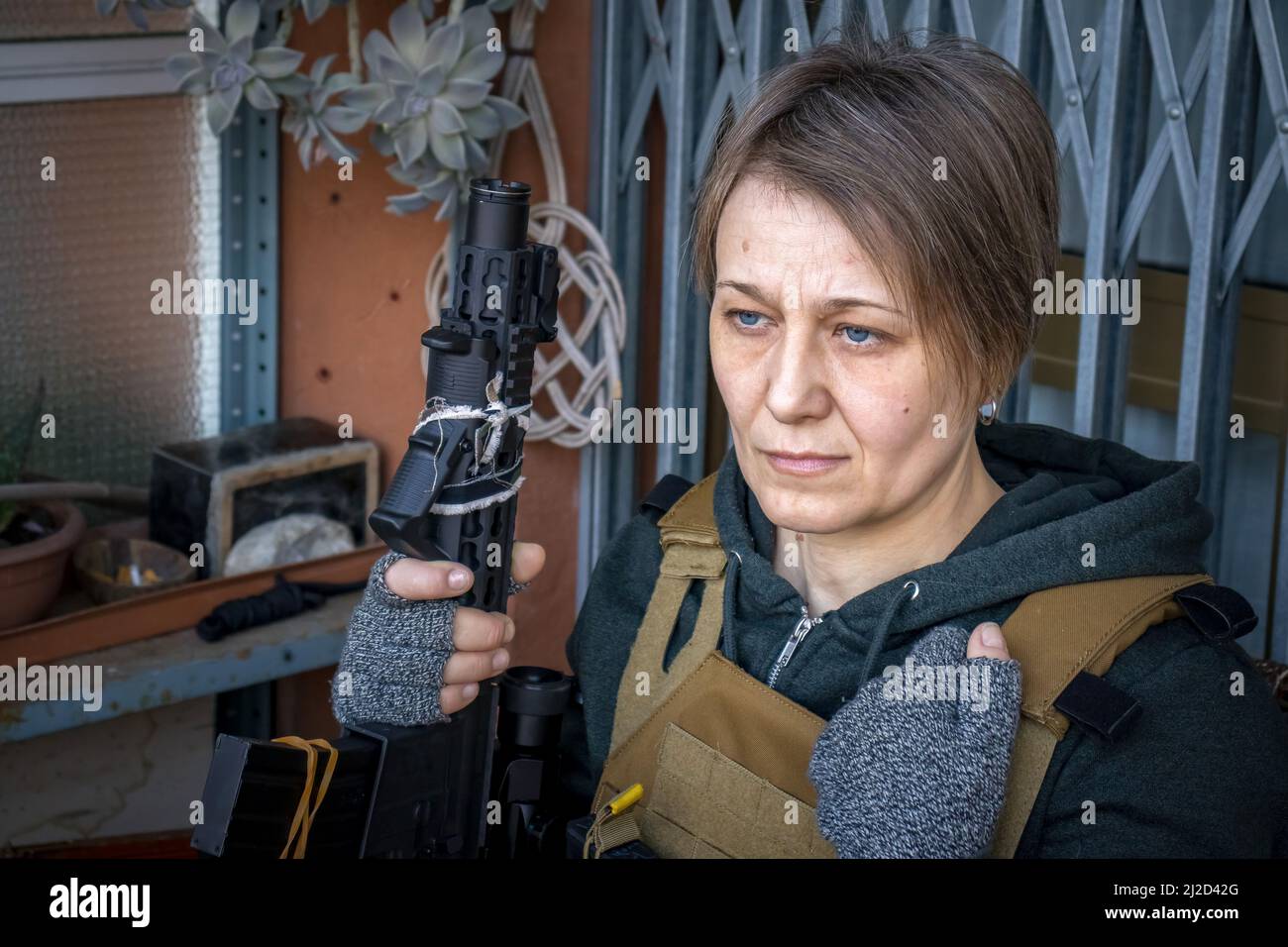 Real Ukrainian civilian woman holding a rifle to defend Ukraine ...