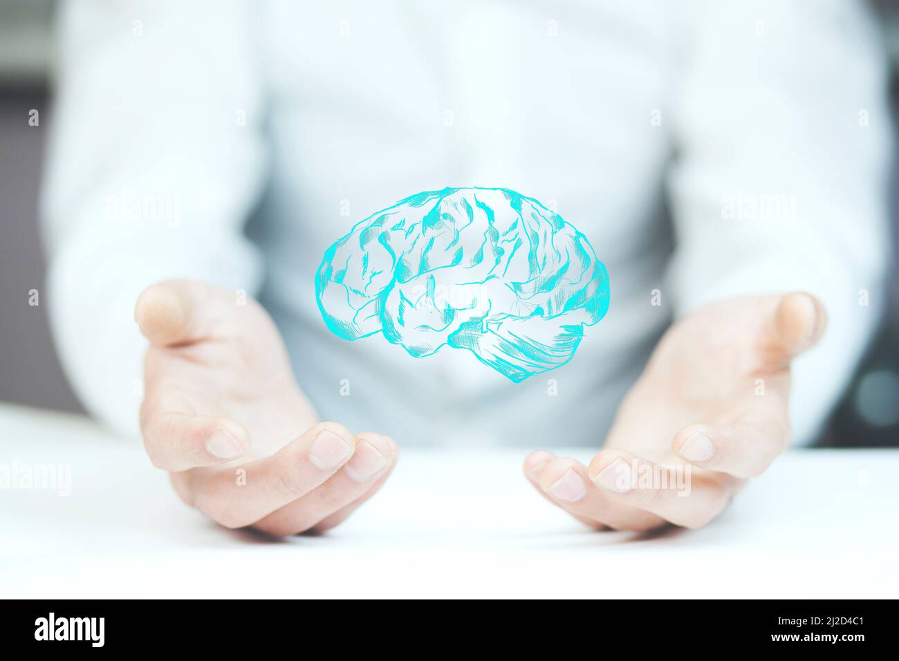 man hand holding brain on white background Stock Photo - Alamy